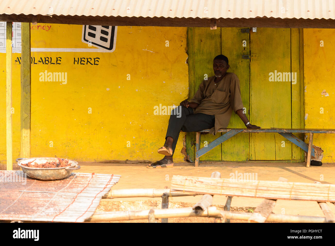 CENTRAL REGION, GHANA - Jan 17, 2017: Unidentified Ghanaian man sits on ...