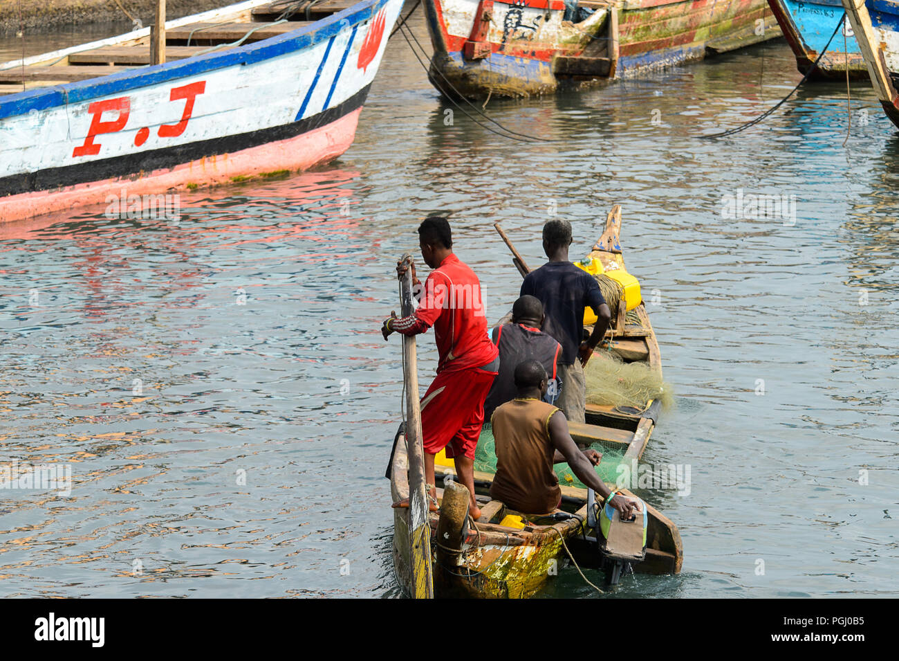 ELMINA, GHANA -JAN 18, 2017: Unidentified Ghanaian men sail in boat in ...