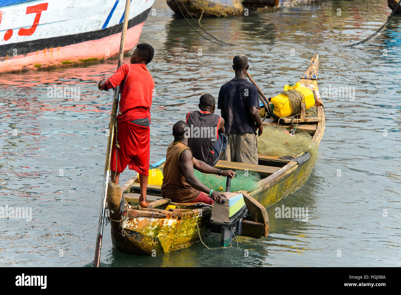 ELMINA, GHANA -JAN 18, 2017: Unidentified Ghanaian men sail in boat in ...