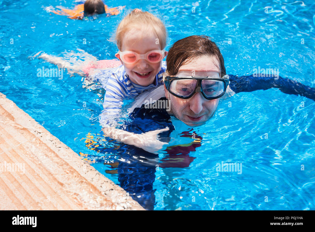 Brother And Sister Swimming Together High Resolution Stock Photography ...