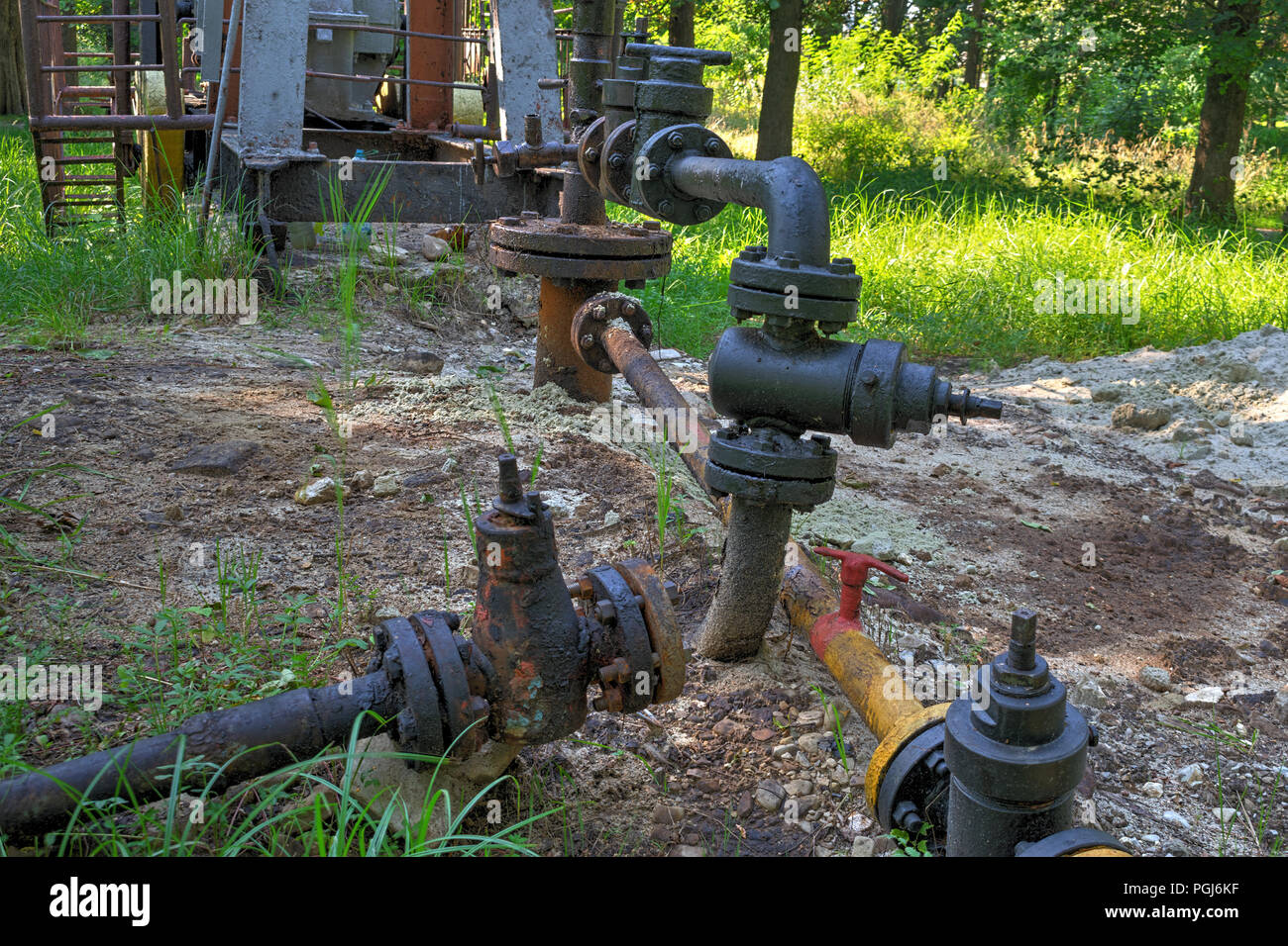 Oil pipes and valves near the oil rig Stock Photo - Alamy