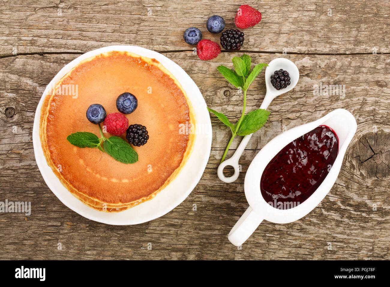 Pancakes stack with different berries isolated on white background. Top ...