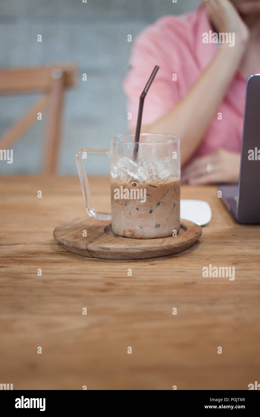 Woman working on computer in coffee shop, stock photo Stock Photo - Alamy
