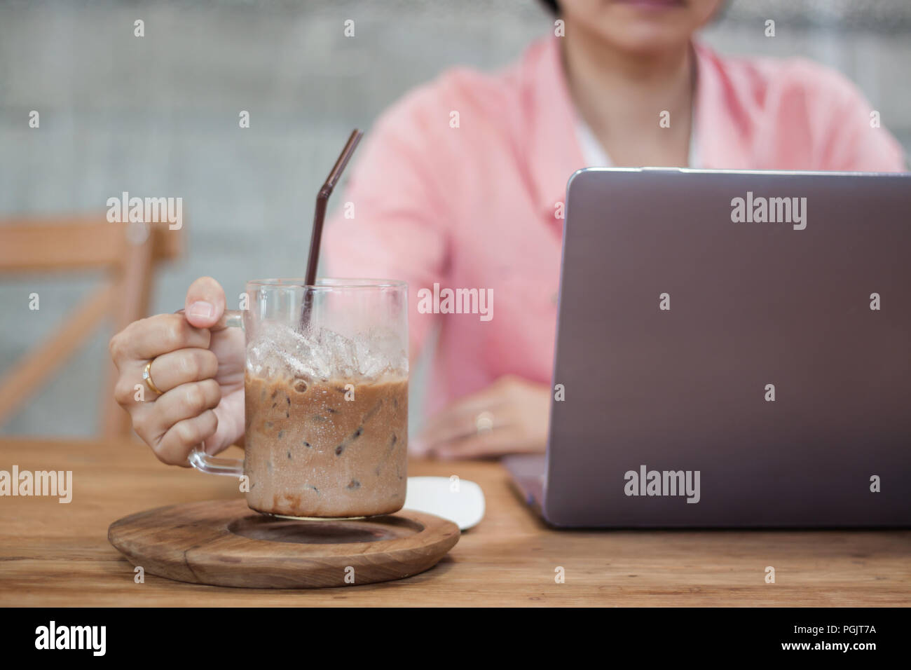 Woman working on computer in coffee shop, stock photo Stock Photo - Alamy