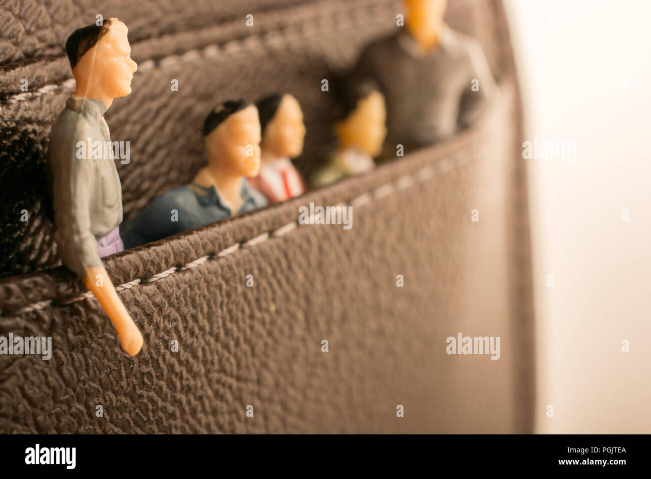 Tiny figurine of group of men miniature model in pockets Stock Photo ...