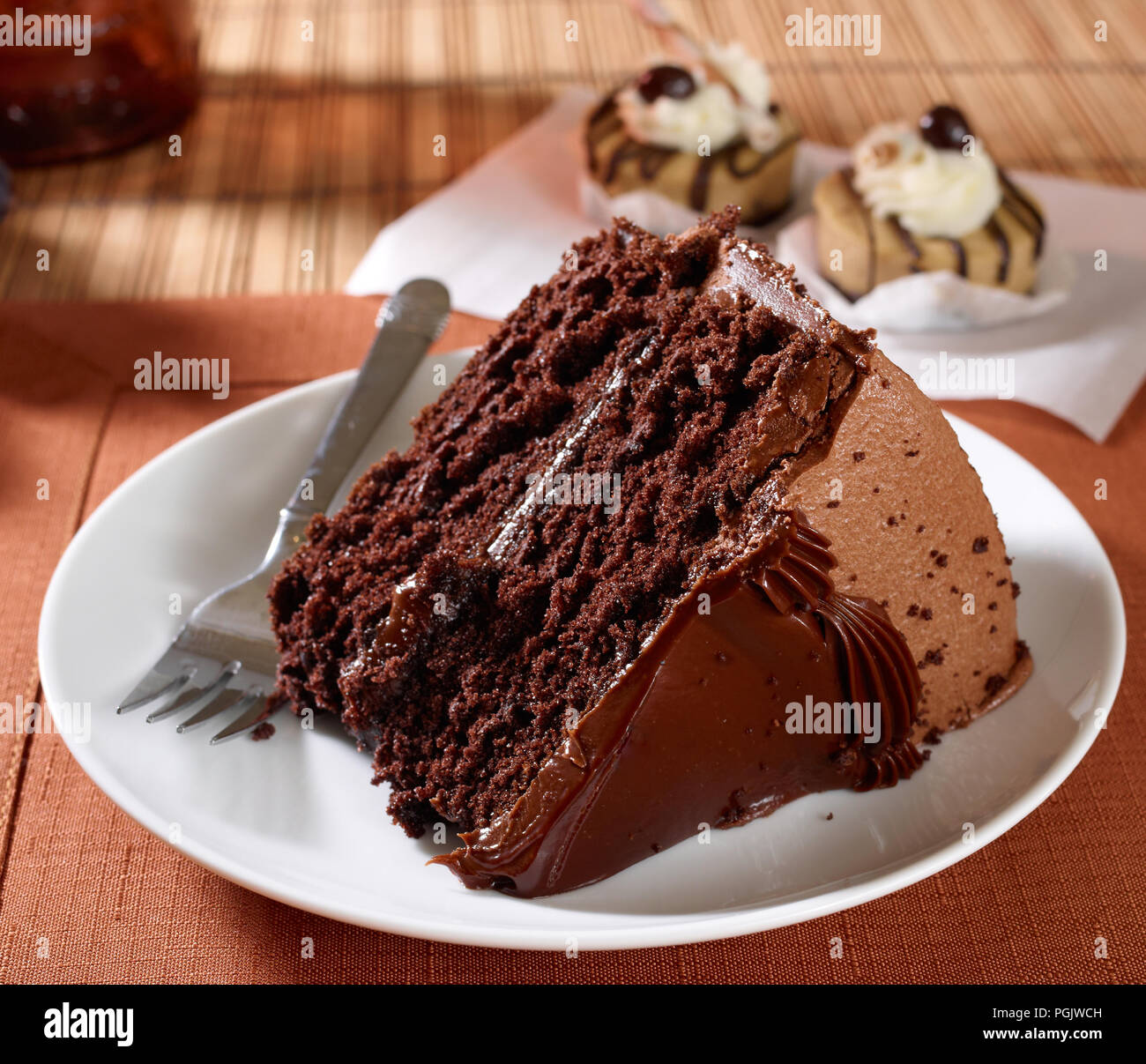 A slice of rich moist devil's food chocolate cake - photographed with a ...