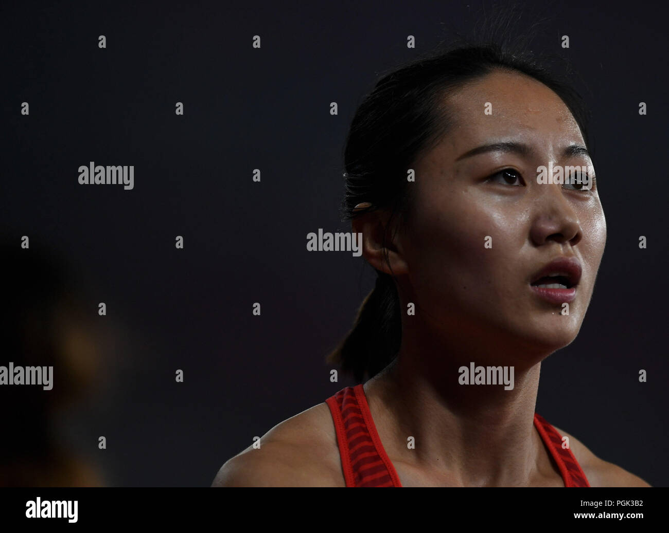 Jakarta. 27th Aug, 2018. Huang Yan of China reacts after women's 400m ...