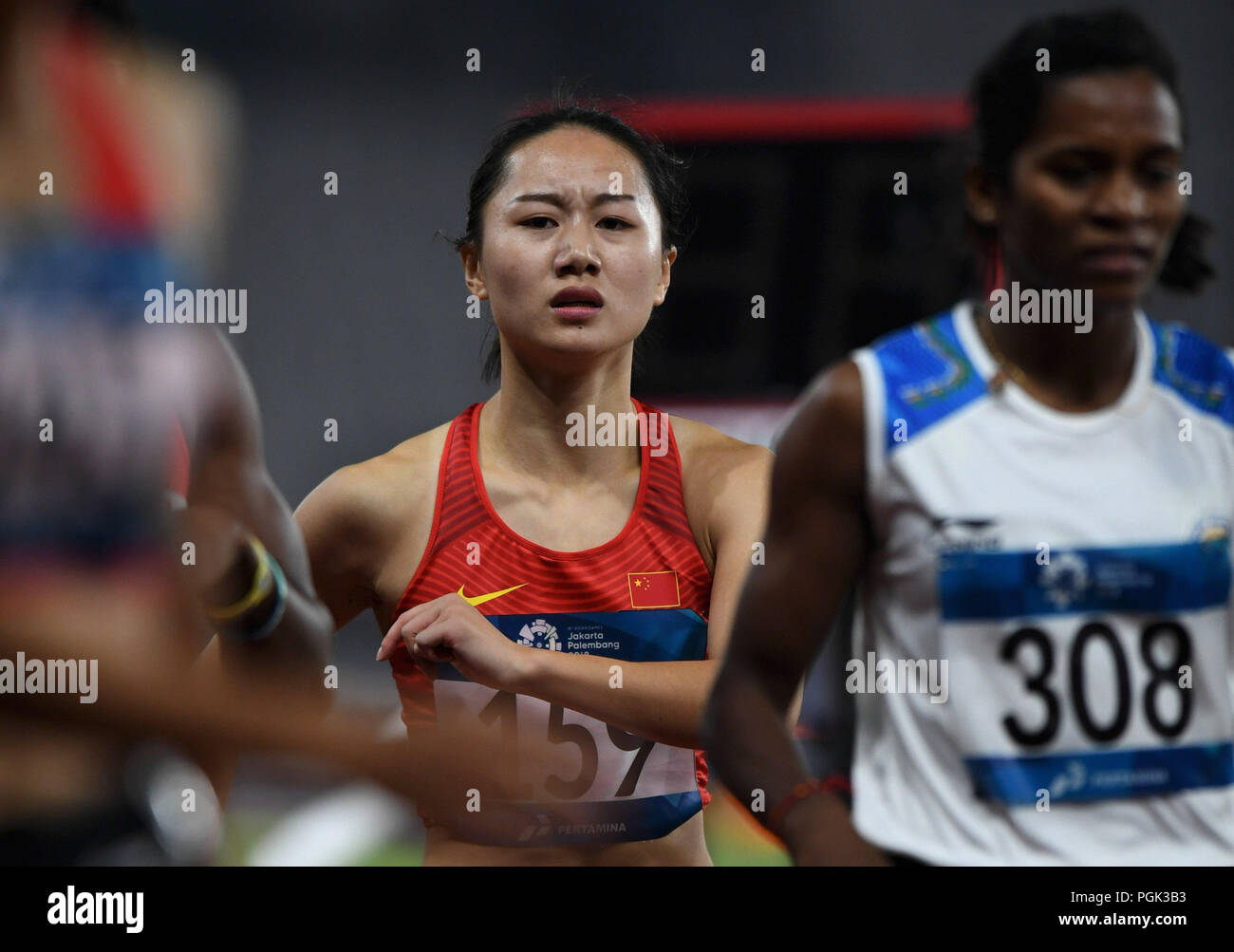 Jakarta. 27th Aug, 2018. Huang Yan of China reacts after women's 400m ...