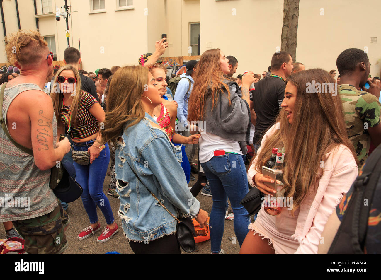 Powis Square, London, UK, 27th August 2108, Notting Hill Carnival goers ...