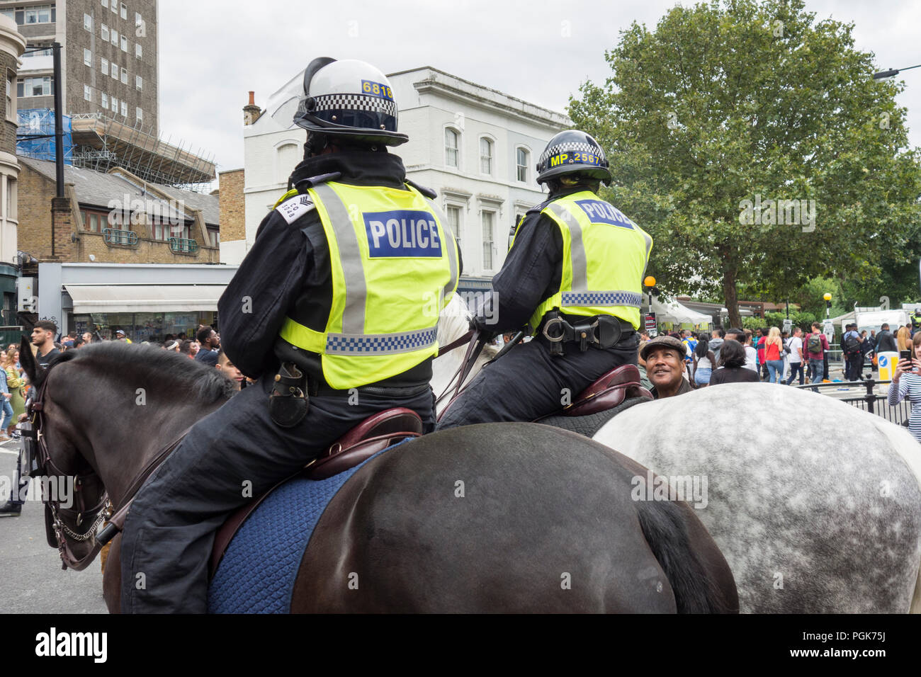 Closeup of mounted police on horseback at Notting Hill Carnival, London ...