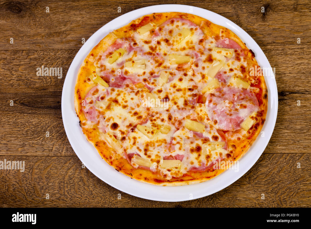 Pizza with ham and cheese Stock Photo - Alamy