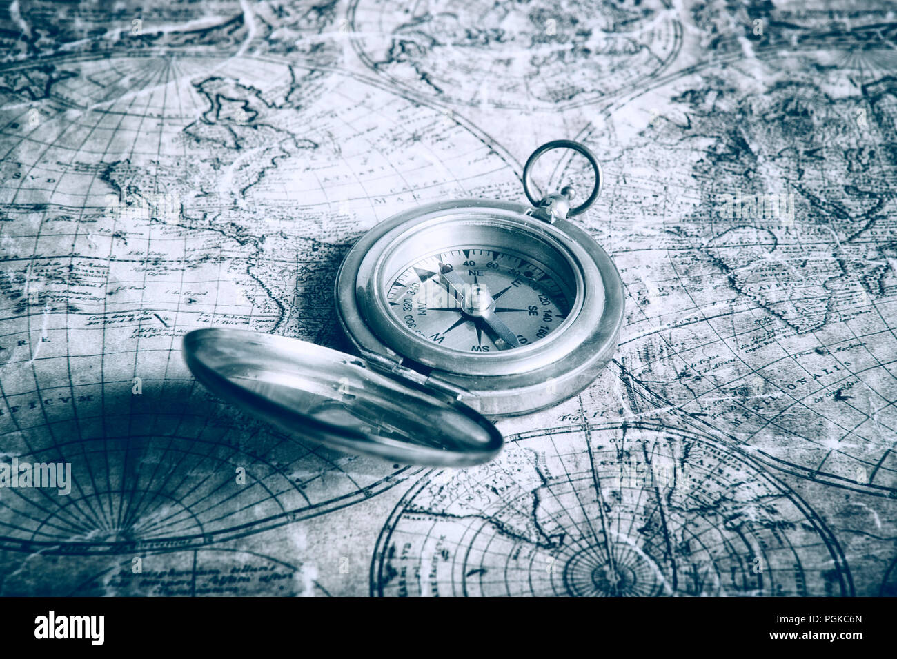 old map of the world and antique brass compass Stock Photo - Alamy