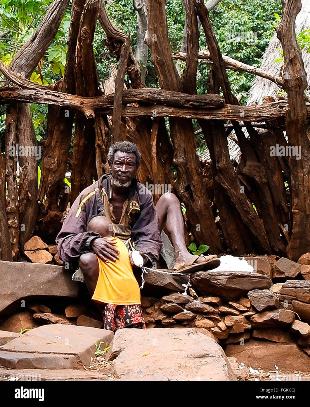 Konso aka Xonsita tribe man with baby in national dress - 03 october ...