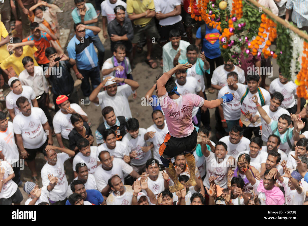 Groups of People enjoying the Dahi Handi festival to celebrate God ...