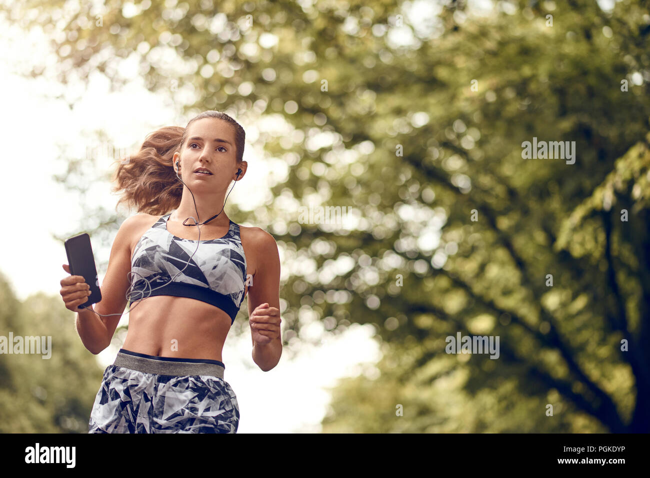 Woman jogging low angle hi-res stock photography and images - Alamy