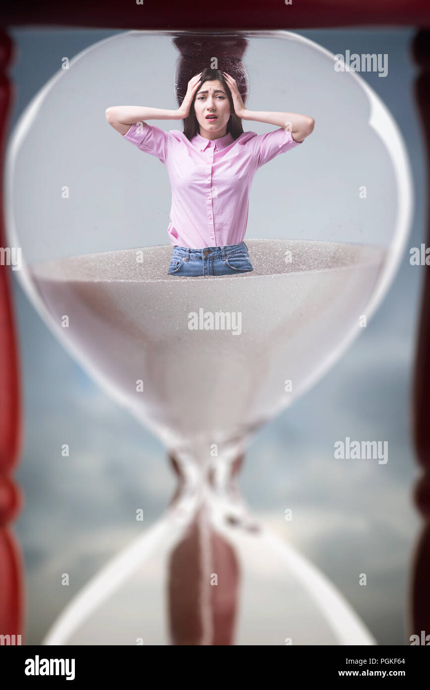 Woman hourglass time sad hi-res stock photography and images - Alamy