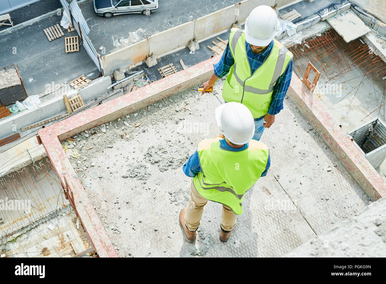 Top view portrait of two unrecognizable construction workers wearing ...