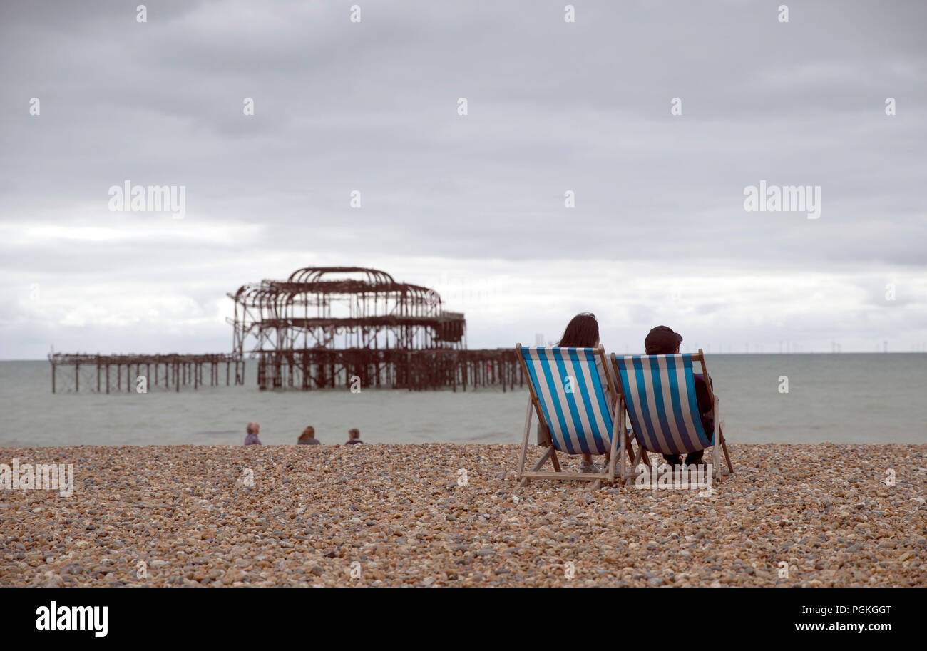 Beachgoers sit hi-res stock photography and images - Alamy