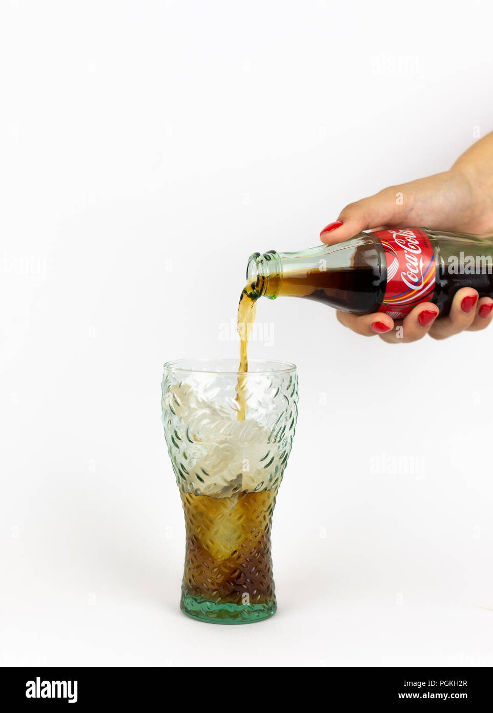 Atlanta, Georgia, USA - July 22, 2018: female hand with red manicure ...