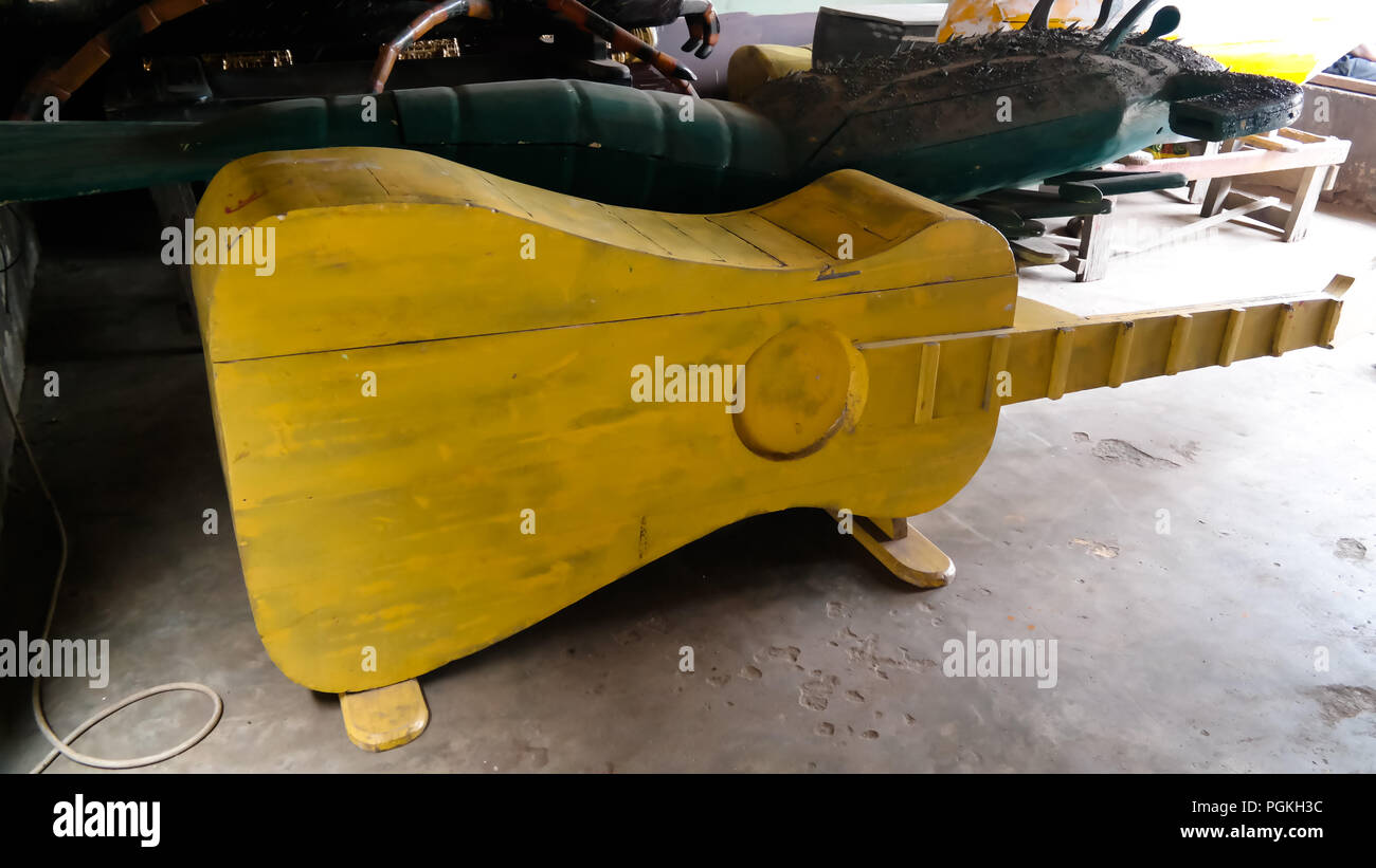 Funny traditional coffin in the shape of profession, guitar, guitarist ...