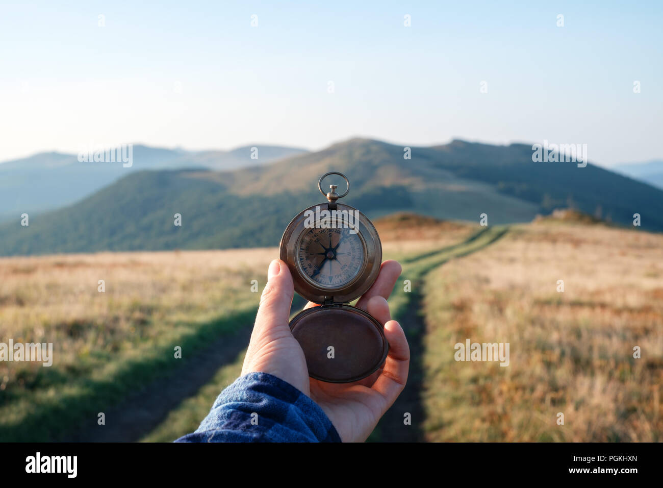 Man with compass in hand Stock Photo - Alamy