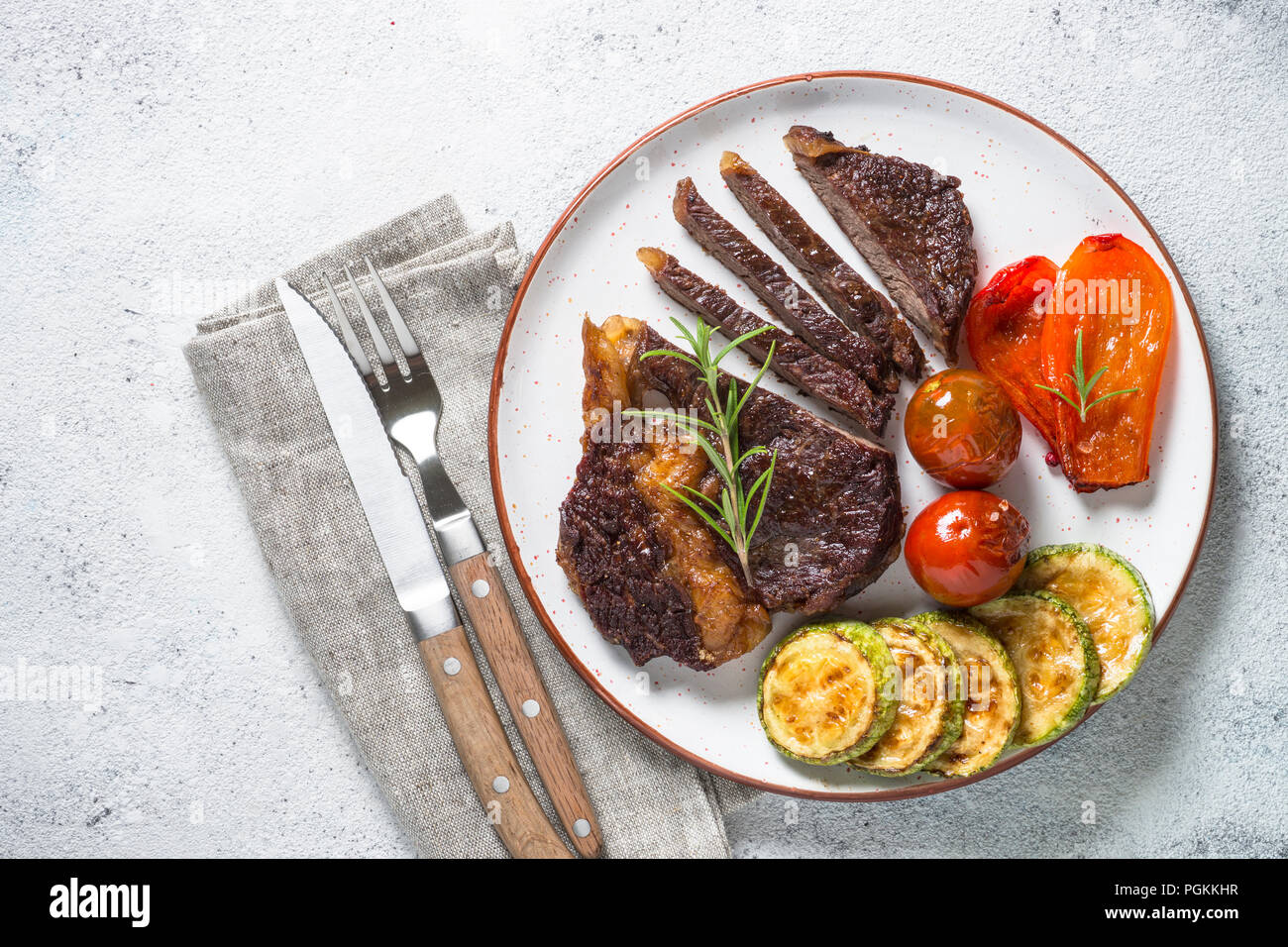 Grilled beef steak with vegetables top view Stock Photo - Alamy