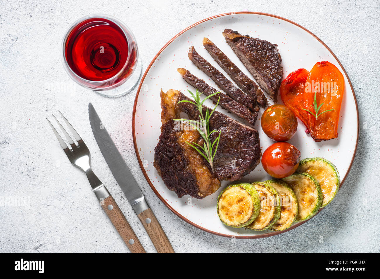 Grilled beef steak with vegetables top view Stock Photo - Alamy