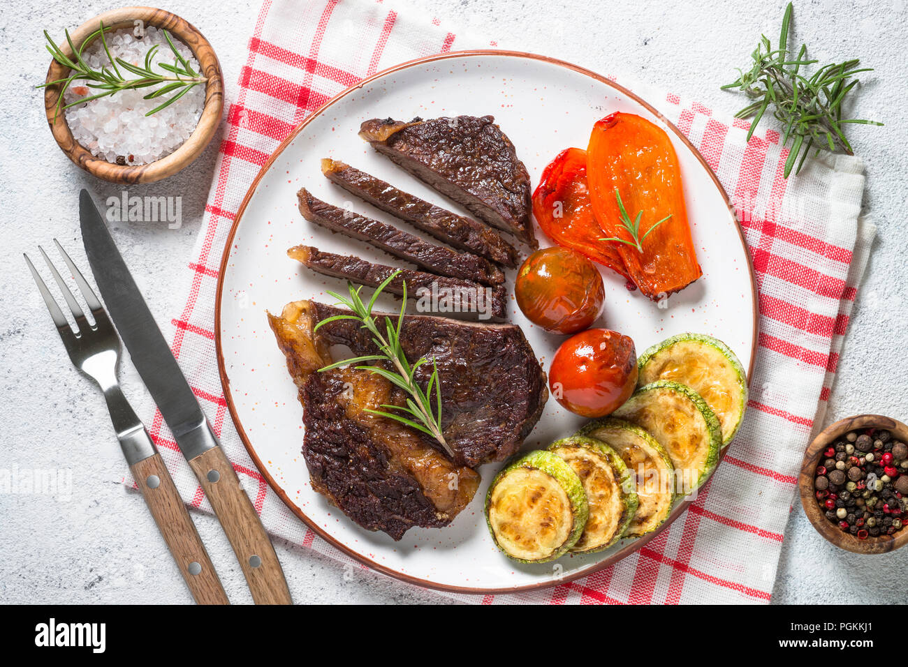 Grilled beef steak with vegetables top view Stock Photo - Alamy