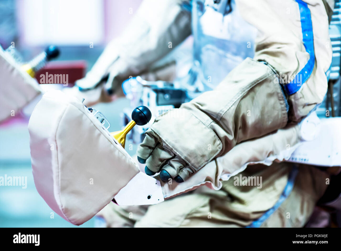 A astronaut and cosmonaut perform work on a space station with ...