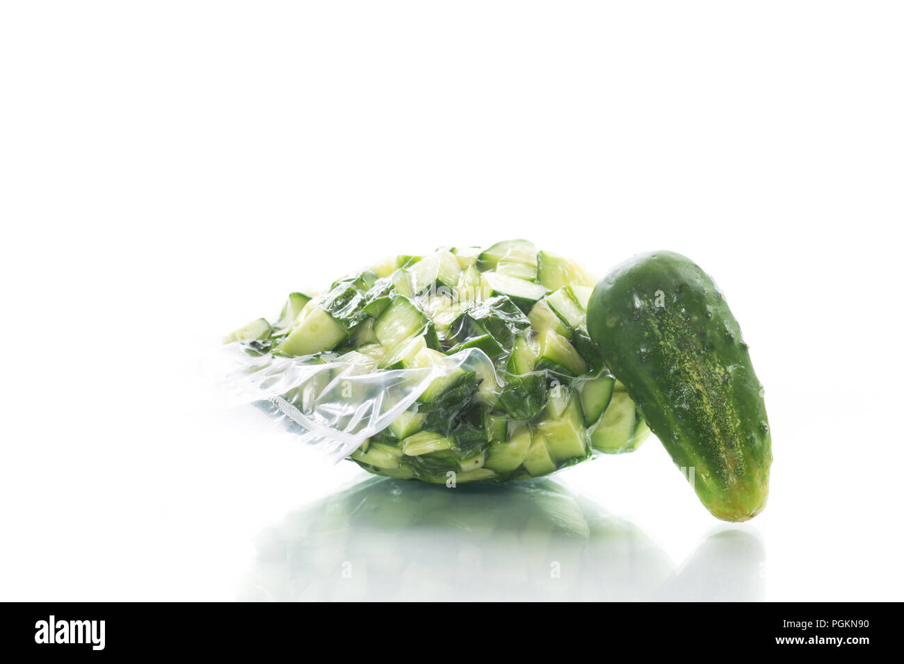 fresh sliced cucumbers in a vacuum package on a white background Stock ...