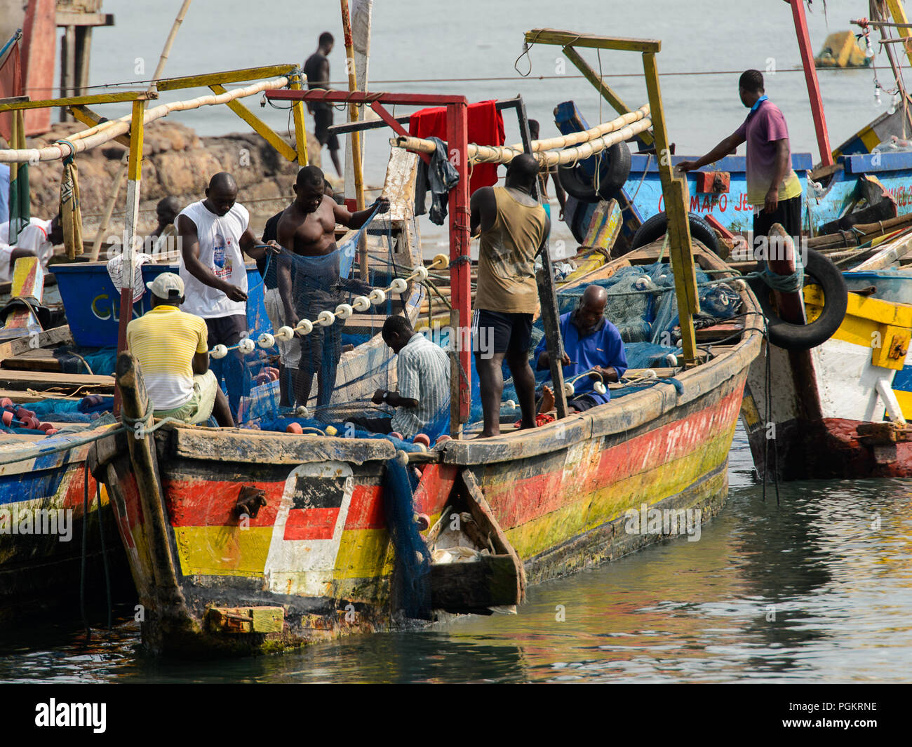 ELMINA, GHANA -JAN 18, 2017: Unidentified Ghanaian men sail on boat in ...