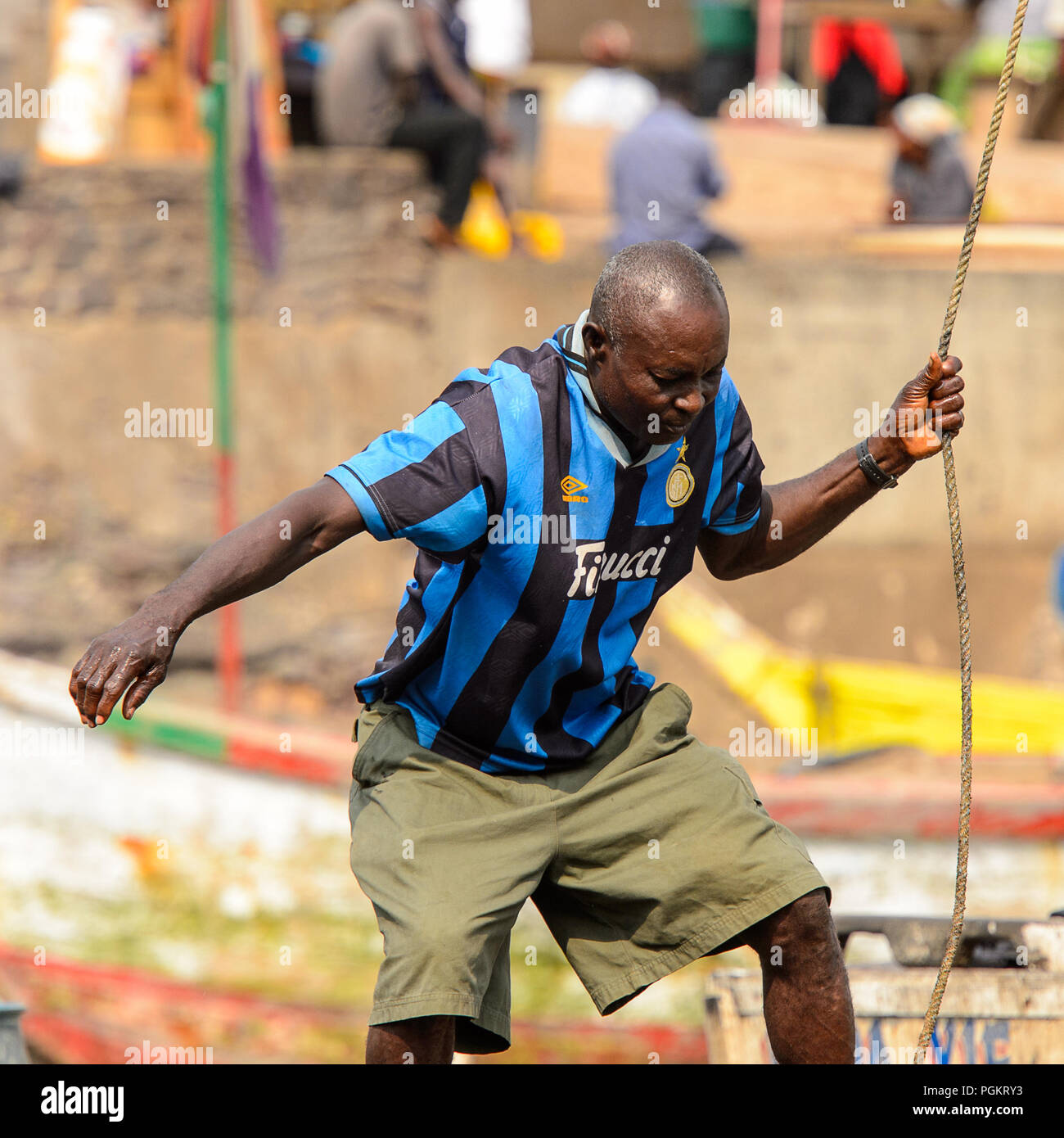 ELMINA, GHANA -JAN 18, 2017: Unidentified Ghanaian man in striped shirt ...