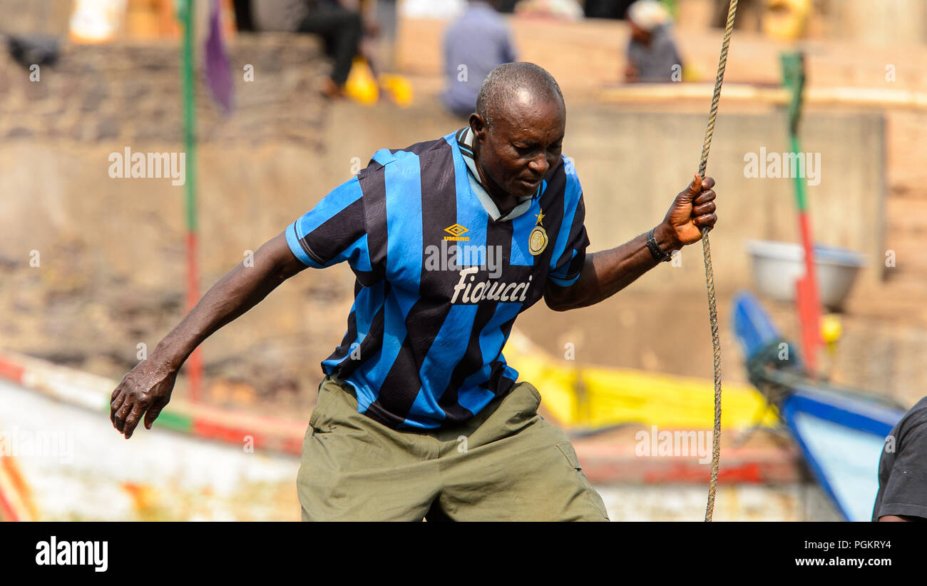 ELMINA, GHANA -JAN 18, 2017: Unidentified Ghanaian man in striped shirt ...