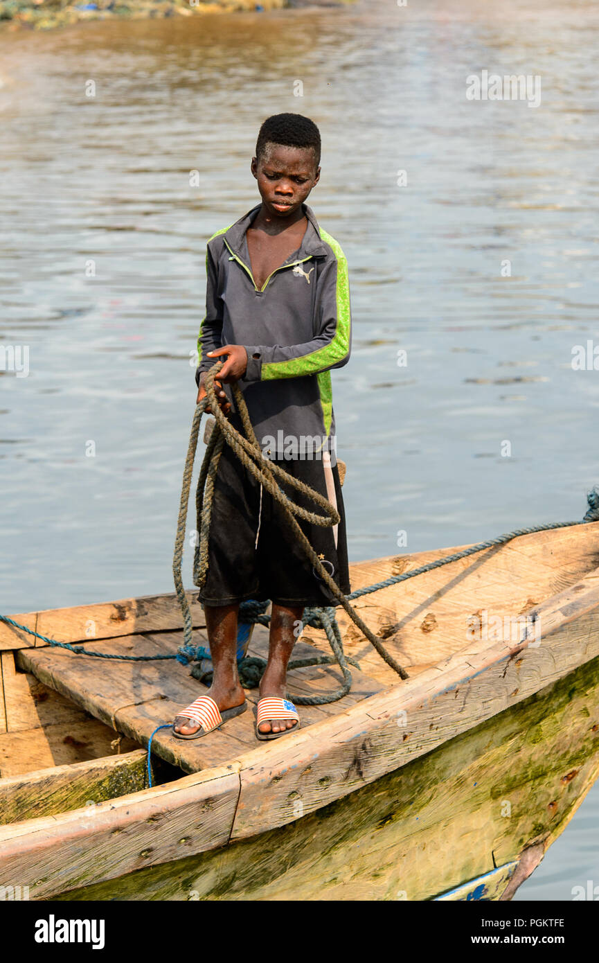 ELMINA, GHANA -JAN 18, 2017: Unidentified Ghanaian boy holds a rope on ...