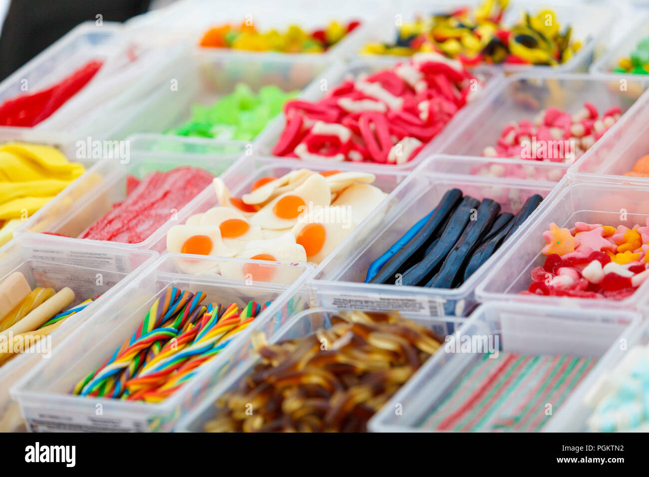 Sweet display on a market Stock Photo - Alamy