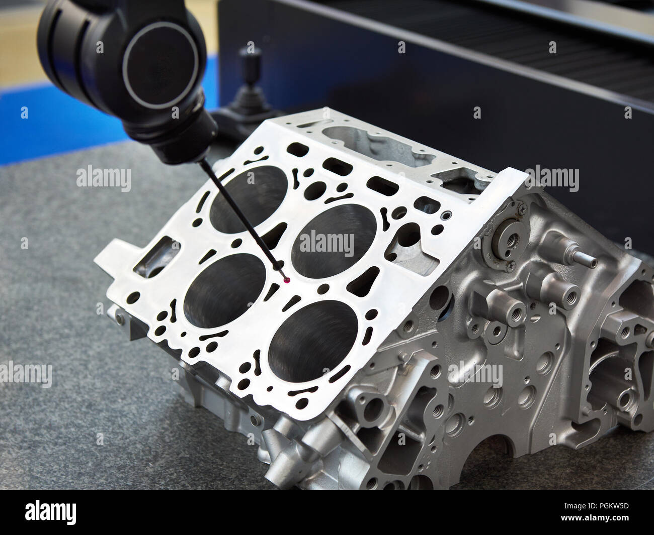 Coordinate measuring machine and main part of engine Stock Photo - Alamy