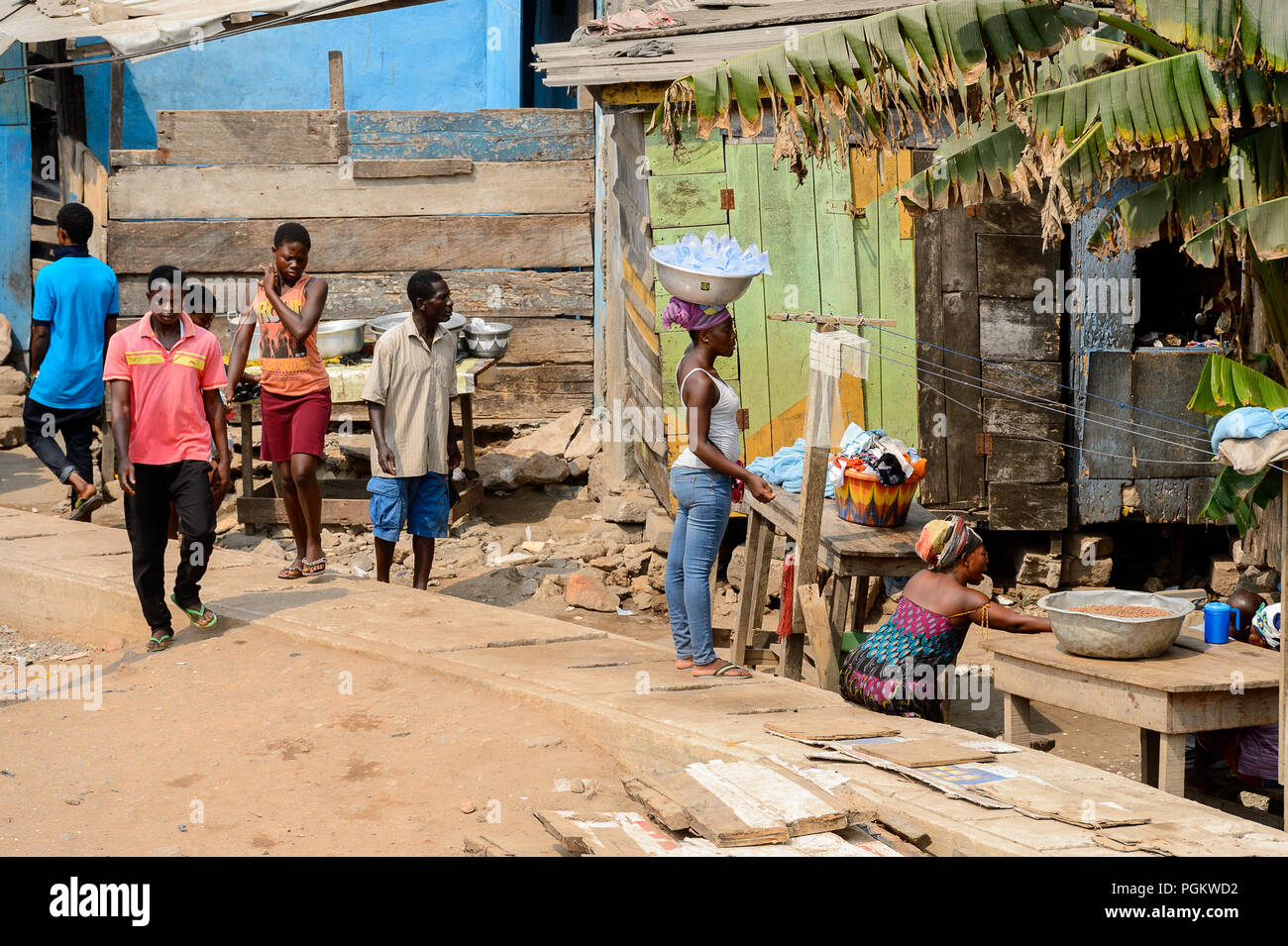 ELMINA, GHANA -JAN 18, 2017: Unidentified Ghanaian people walk on the ...