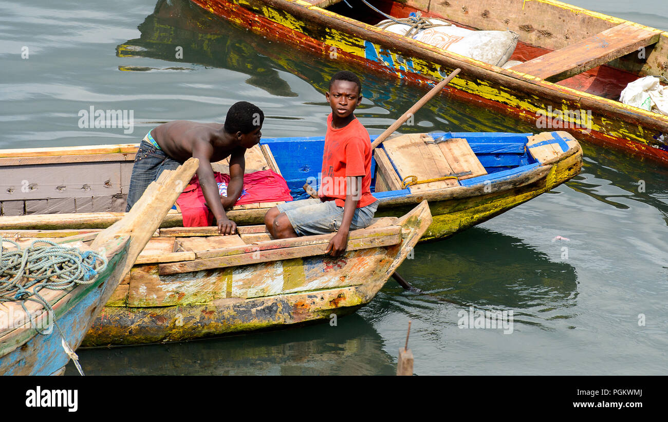 ELMINA, GHANA -JAN 18, 2017: Unidentified Ghanaian men sail on the boat ...