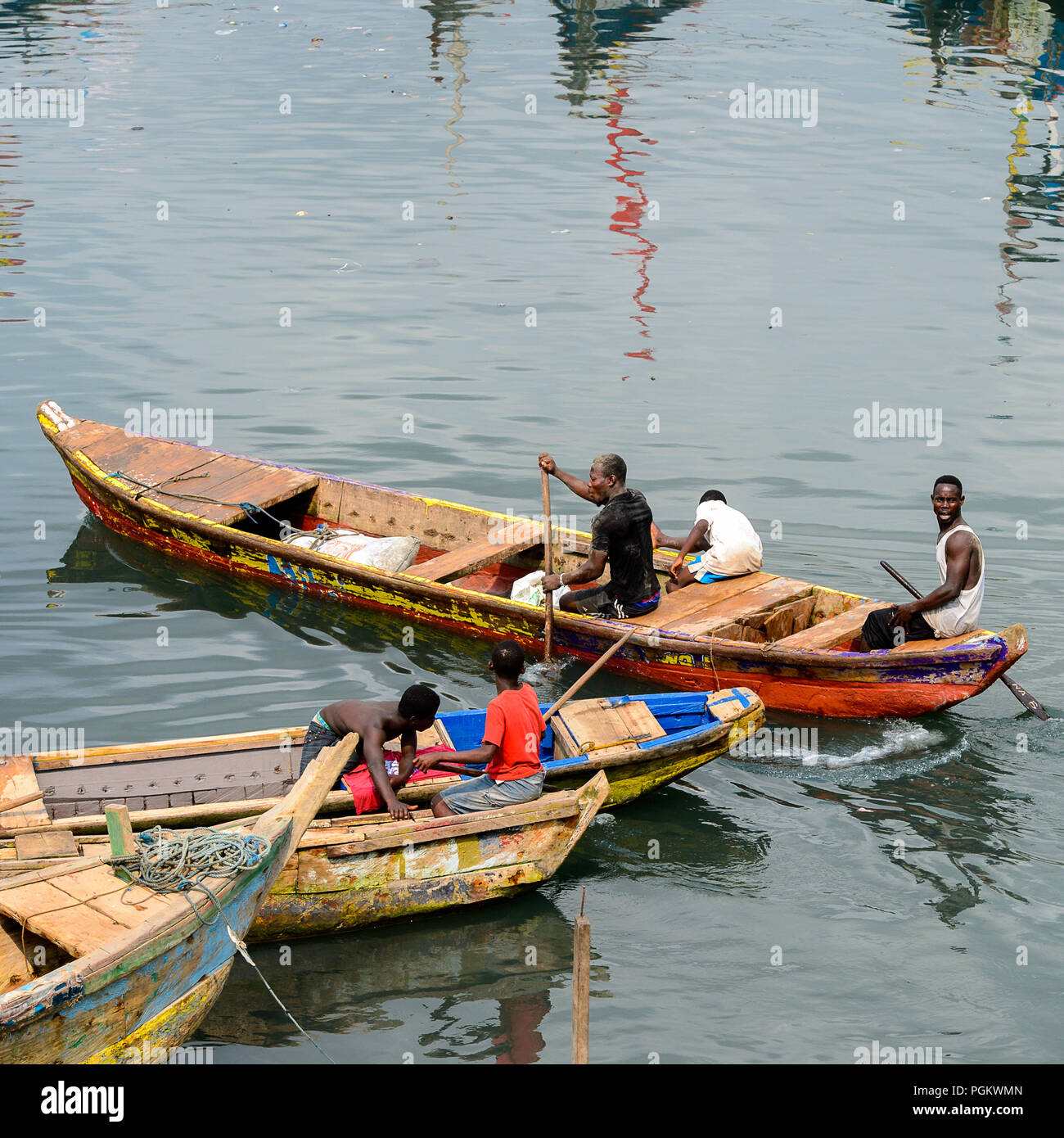 ELMINA, GHANA -JAN 18, 2017: Unidentified Ghanaian men sail on the boat ...