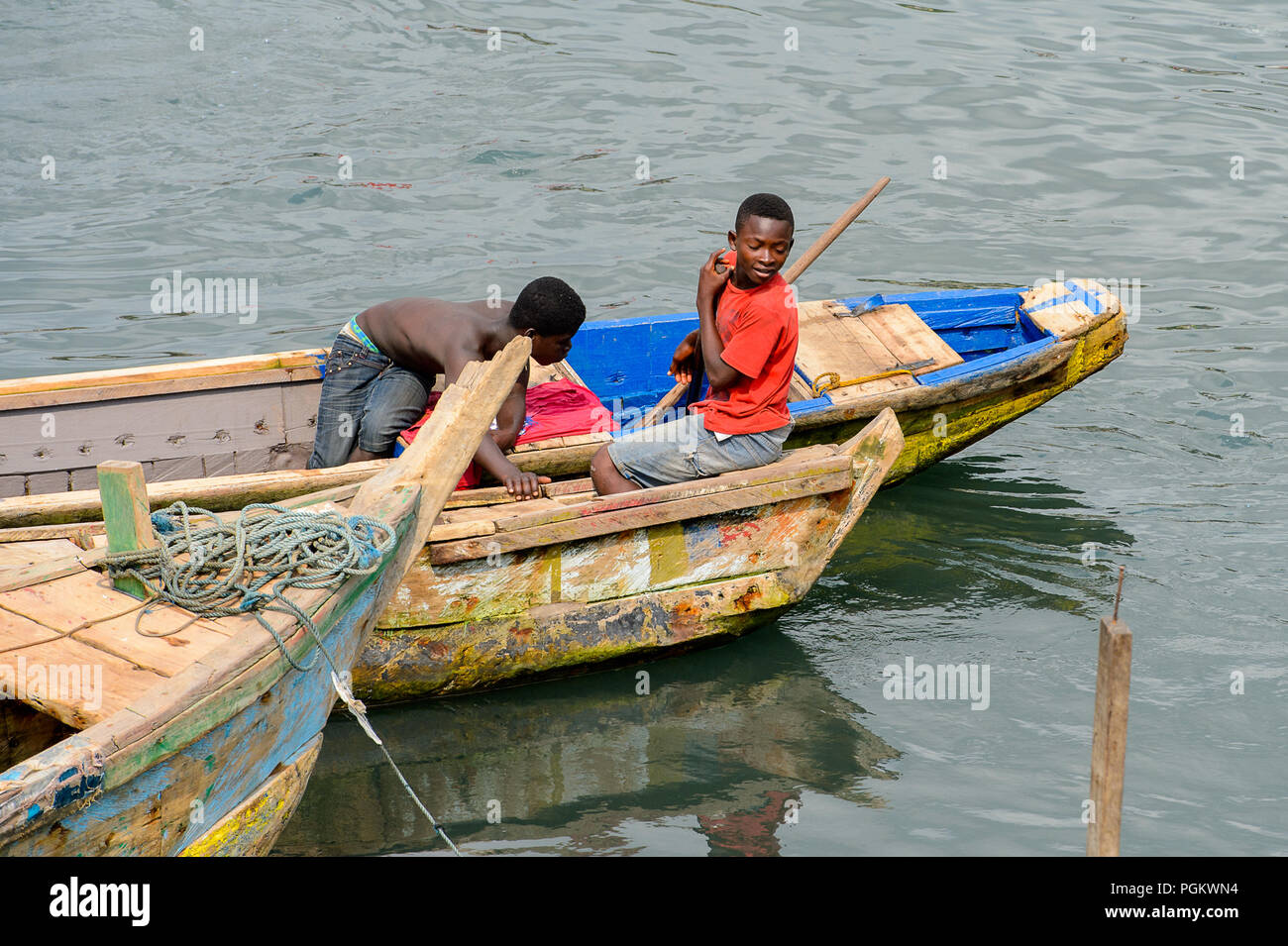 ELMINA, GHANA -JAN 18, 2017: Unidentified Ghanaian men sail on the boat ...