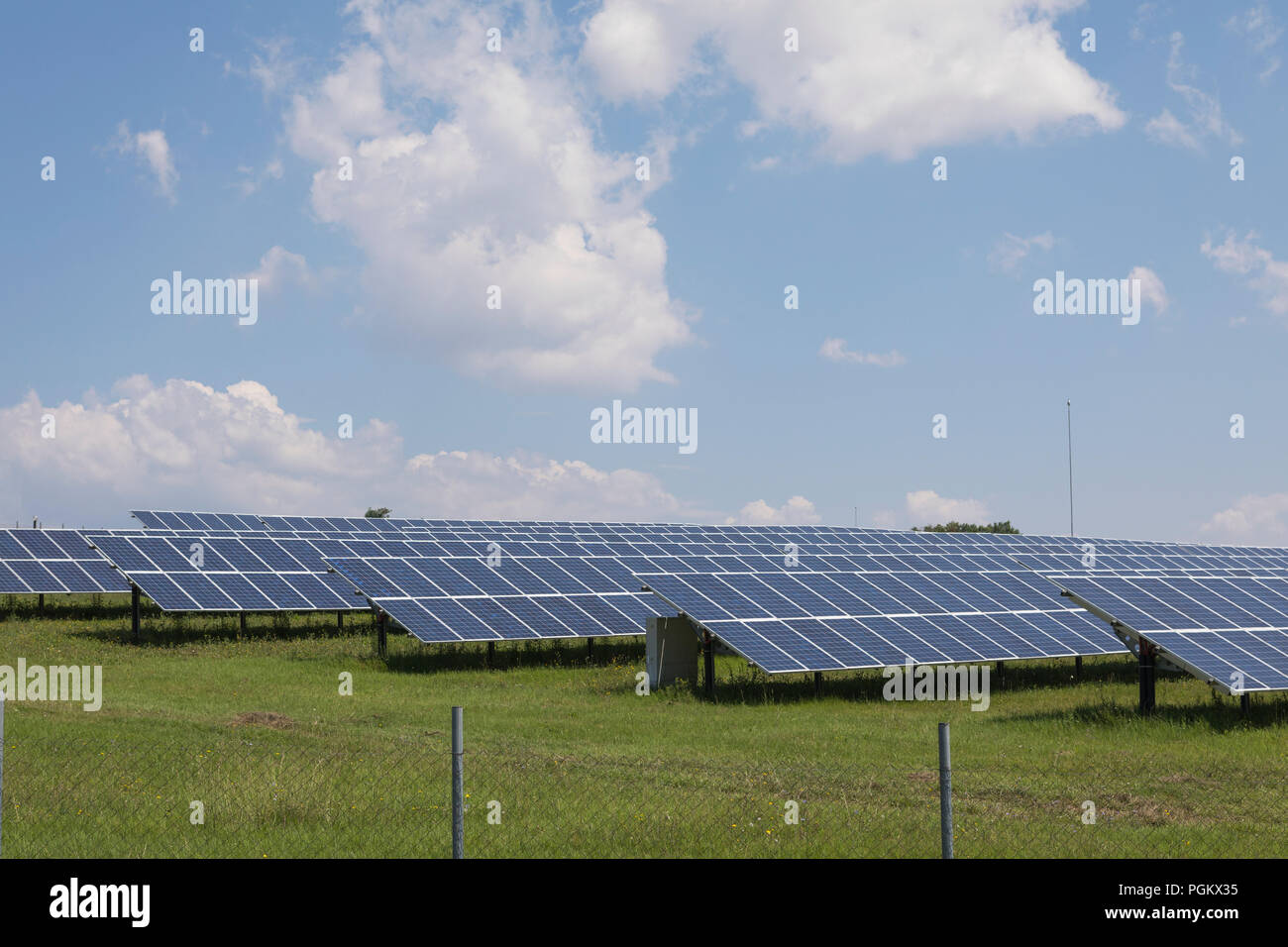 Field with huge amount of PV panels generating electricity near ...