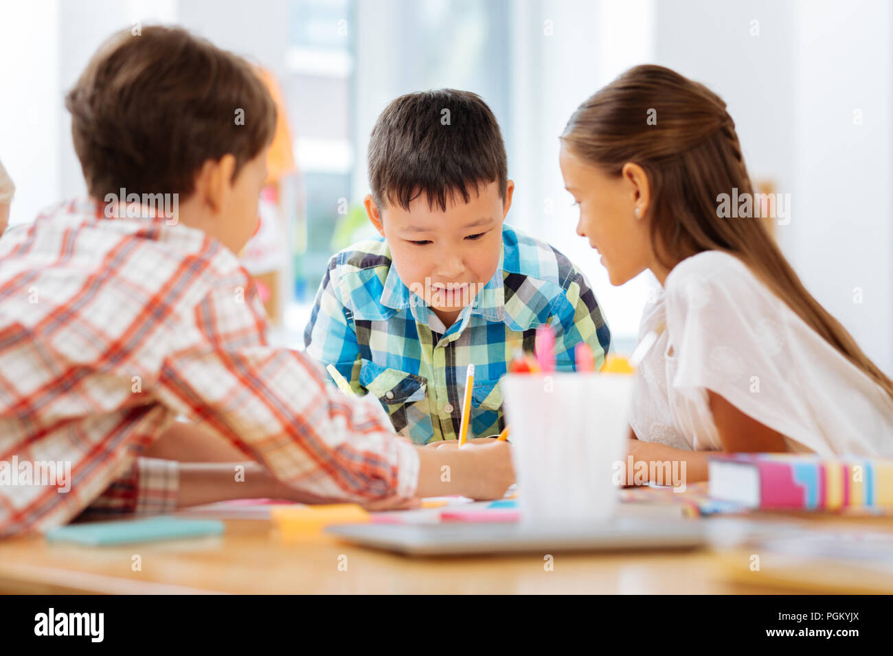 Attentive children being concentrated on drawing a picture Stock Photo ...