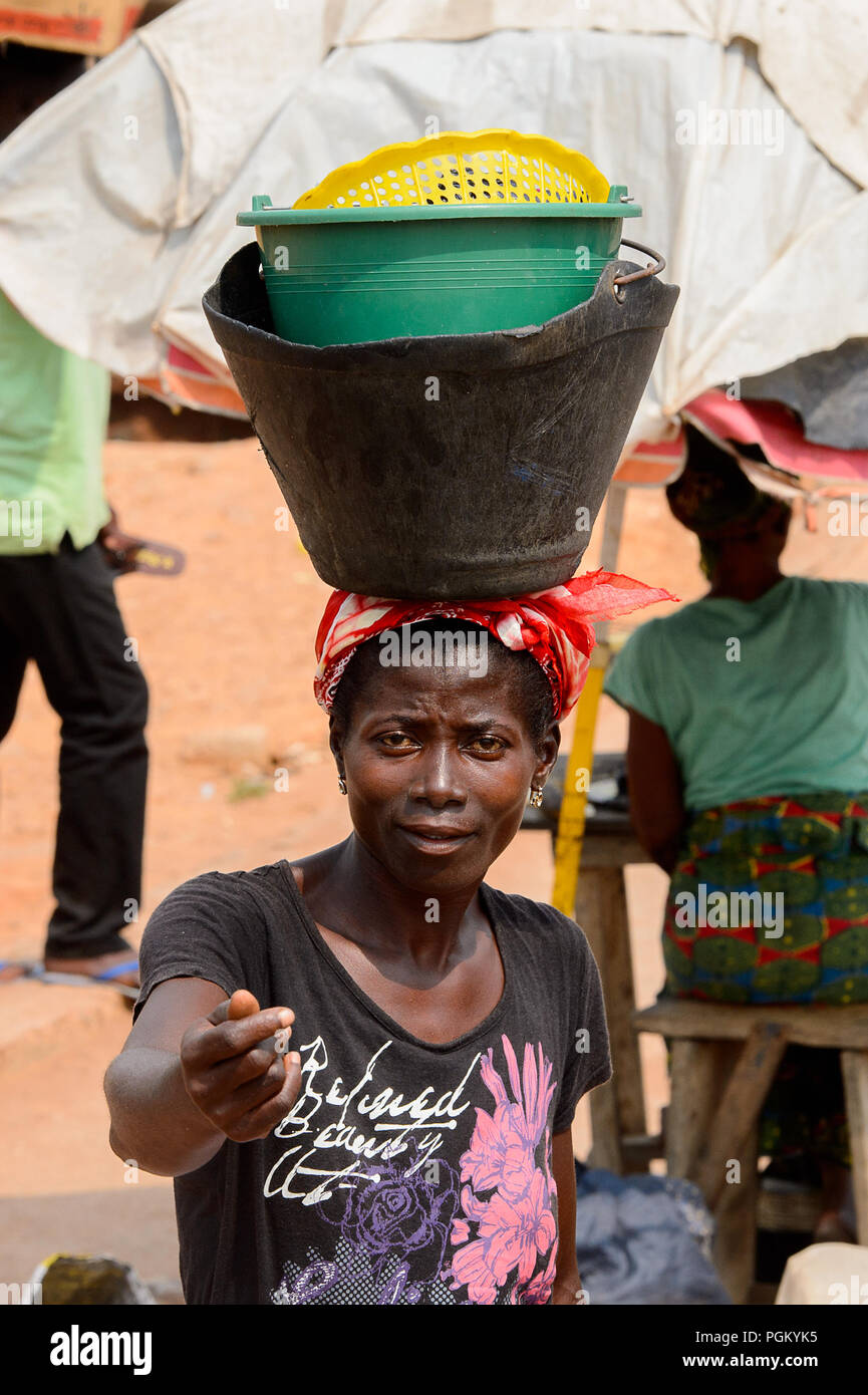 ELMINA, GHANA -JAN 18, 2017: Unidentified Ghanaian woman carries a ...