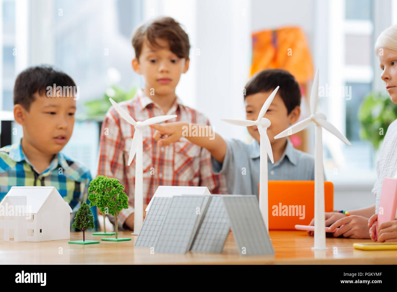 Cute kids making paper figures at school Stock Photo - Alamy
