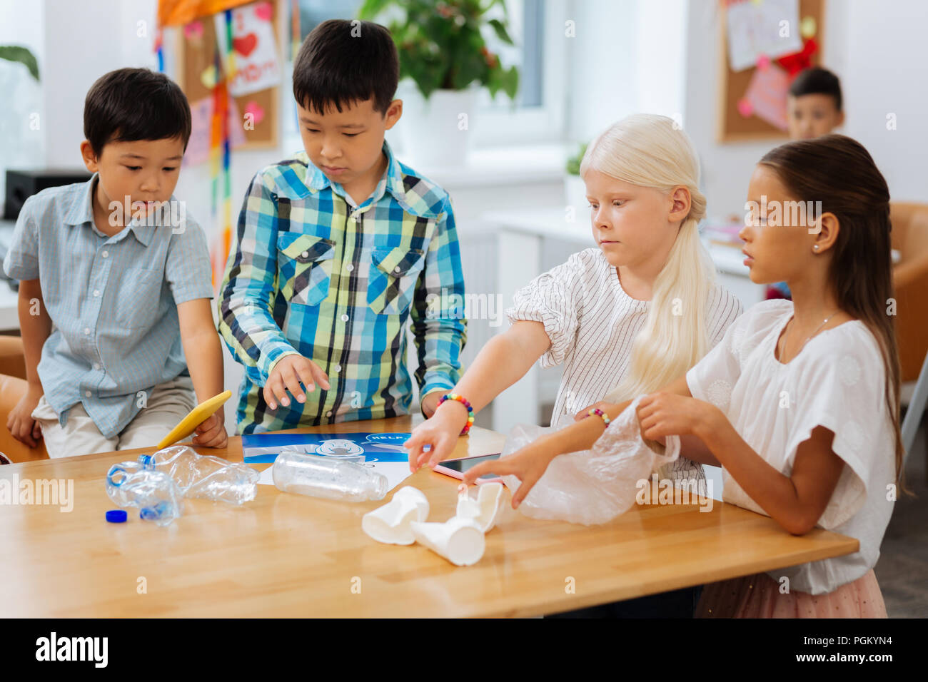 Concentrated children doing their homework all together Stock Photo - Alamy
