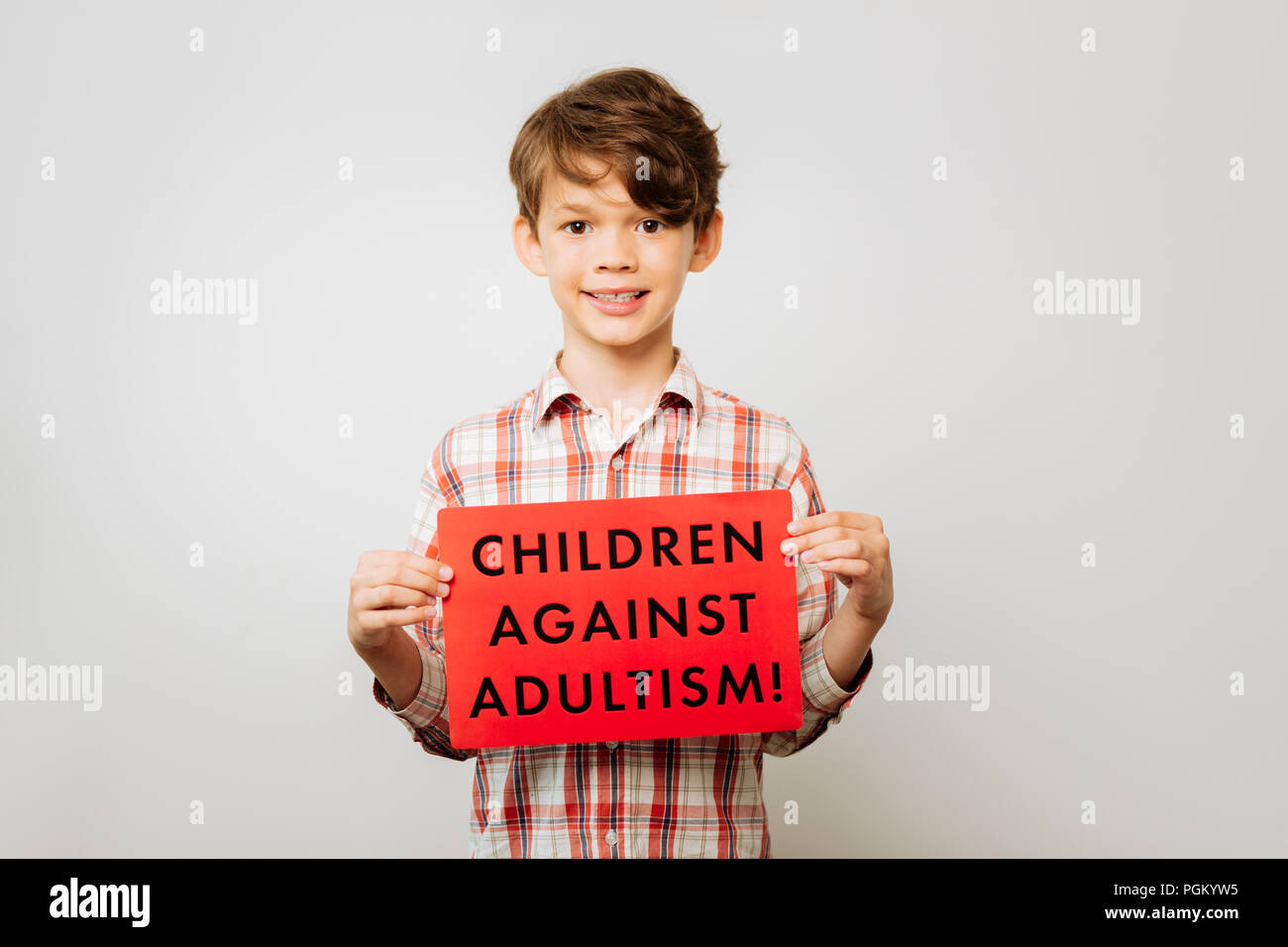 Small boy holding a table in a hand Stock Photo - Alamy