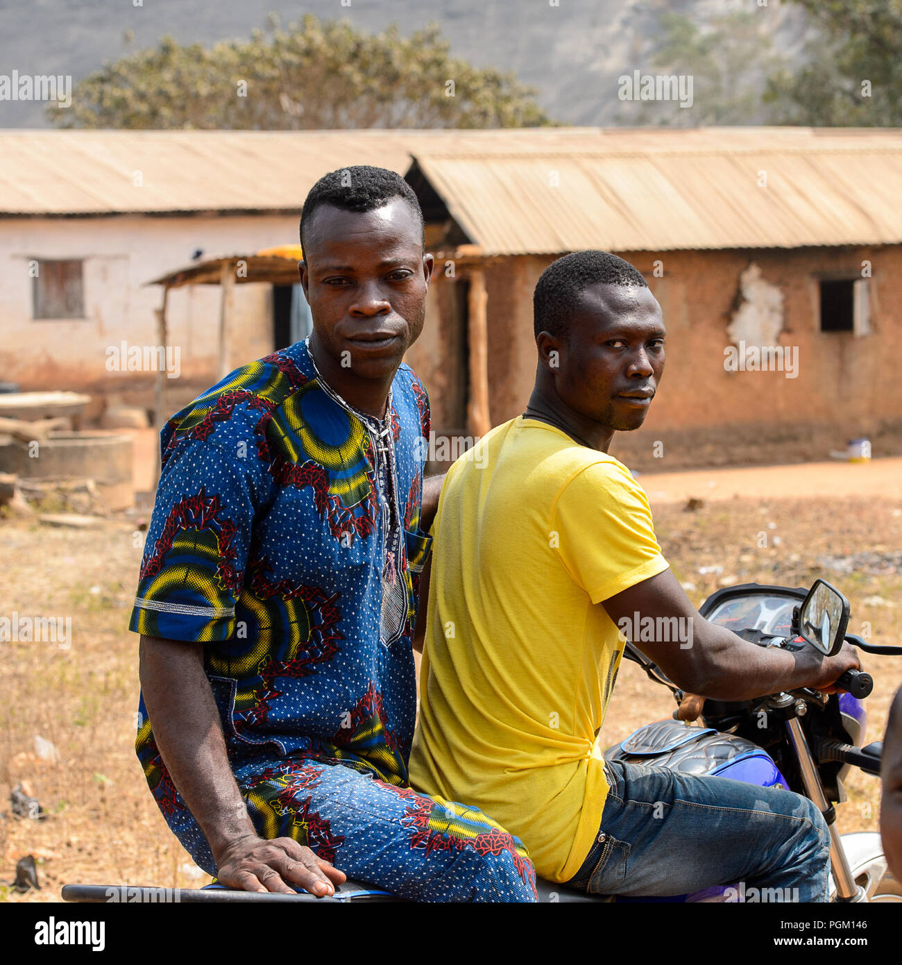 PIRA, BENIN - JAN 12, 2017: Unidentified Beninese men in colored ...