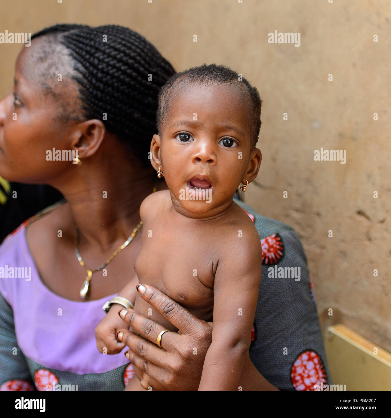 PIRA, BENIN - JAN 12, 2017: Unidentified Beninese woman with braids in ...