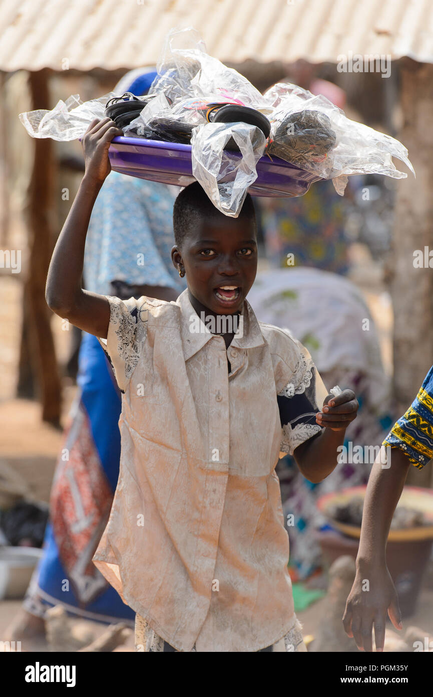 BOHICON, BENIN - JAN 12, 2017: Unidentified Beninese girl carries a ...