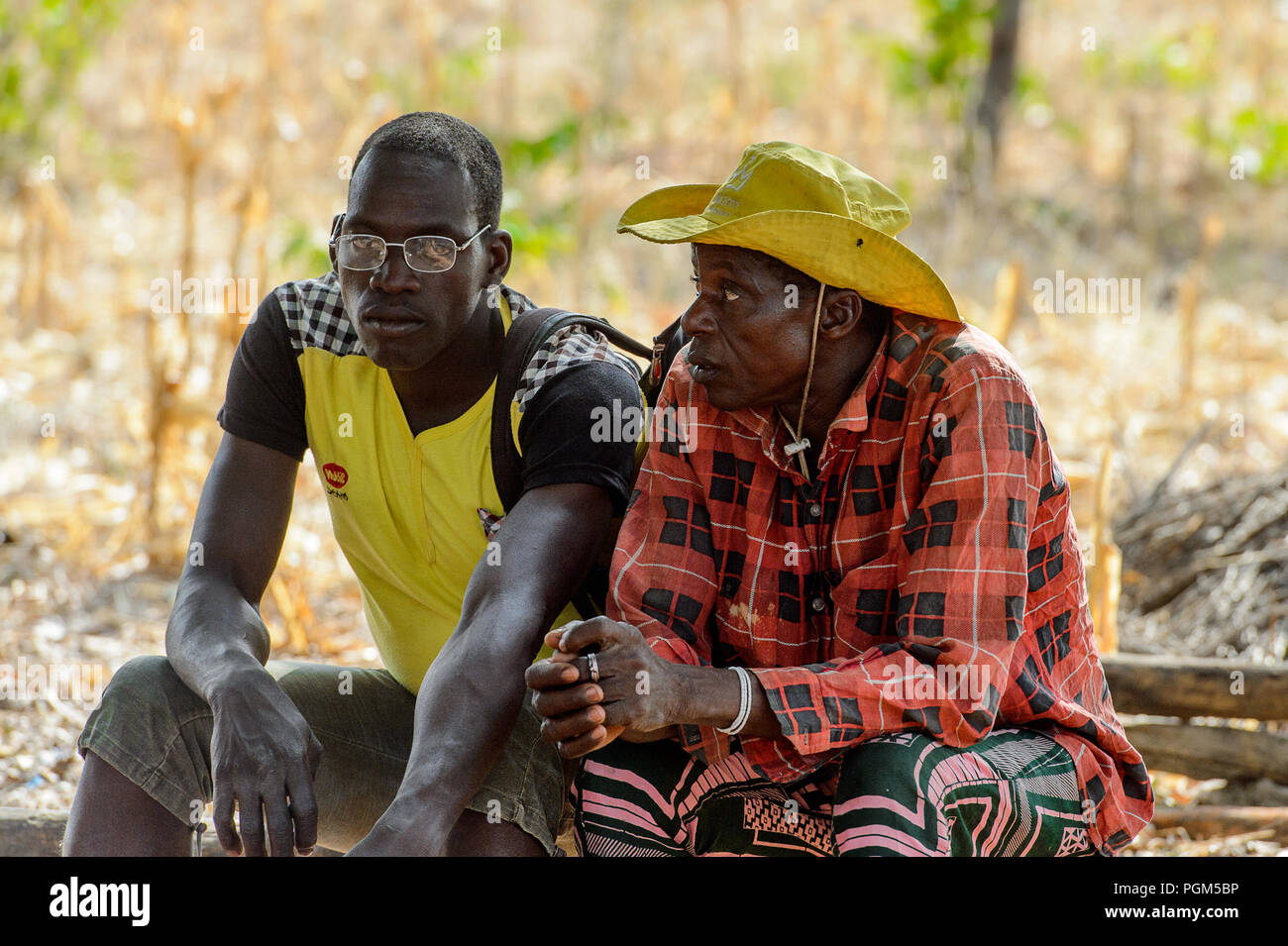 KOUTAMMAKOU, TOGO - JAN 13, 2017: Unidentified Togolese men sit on the ...